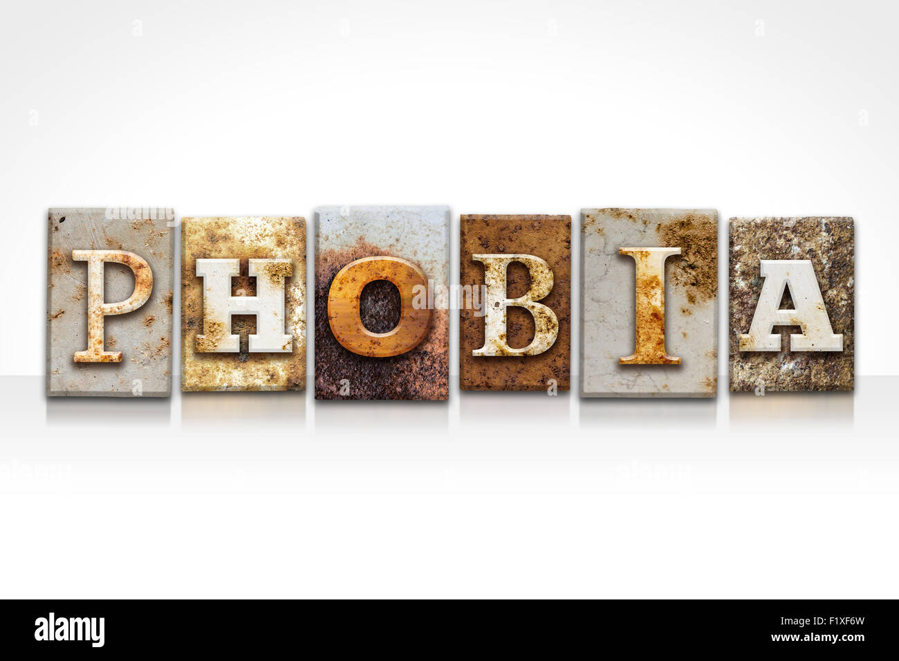 The word "PHOBIA" written in rusty metal letterpress type isolated on a ...