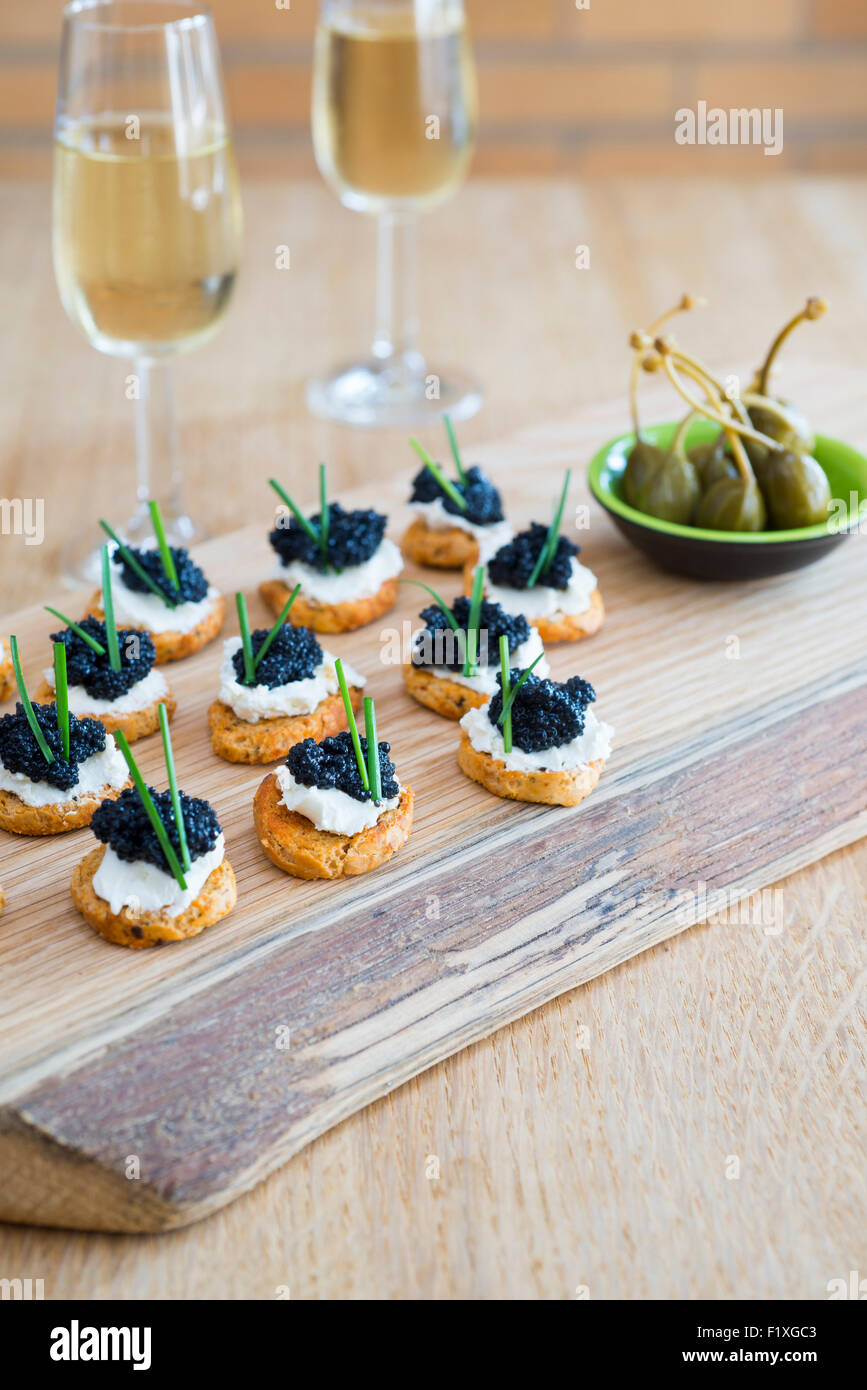 Canapes made from crostini with soft cheese and seaweed 'caviar' Stock ...