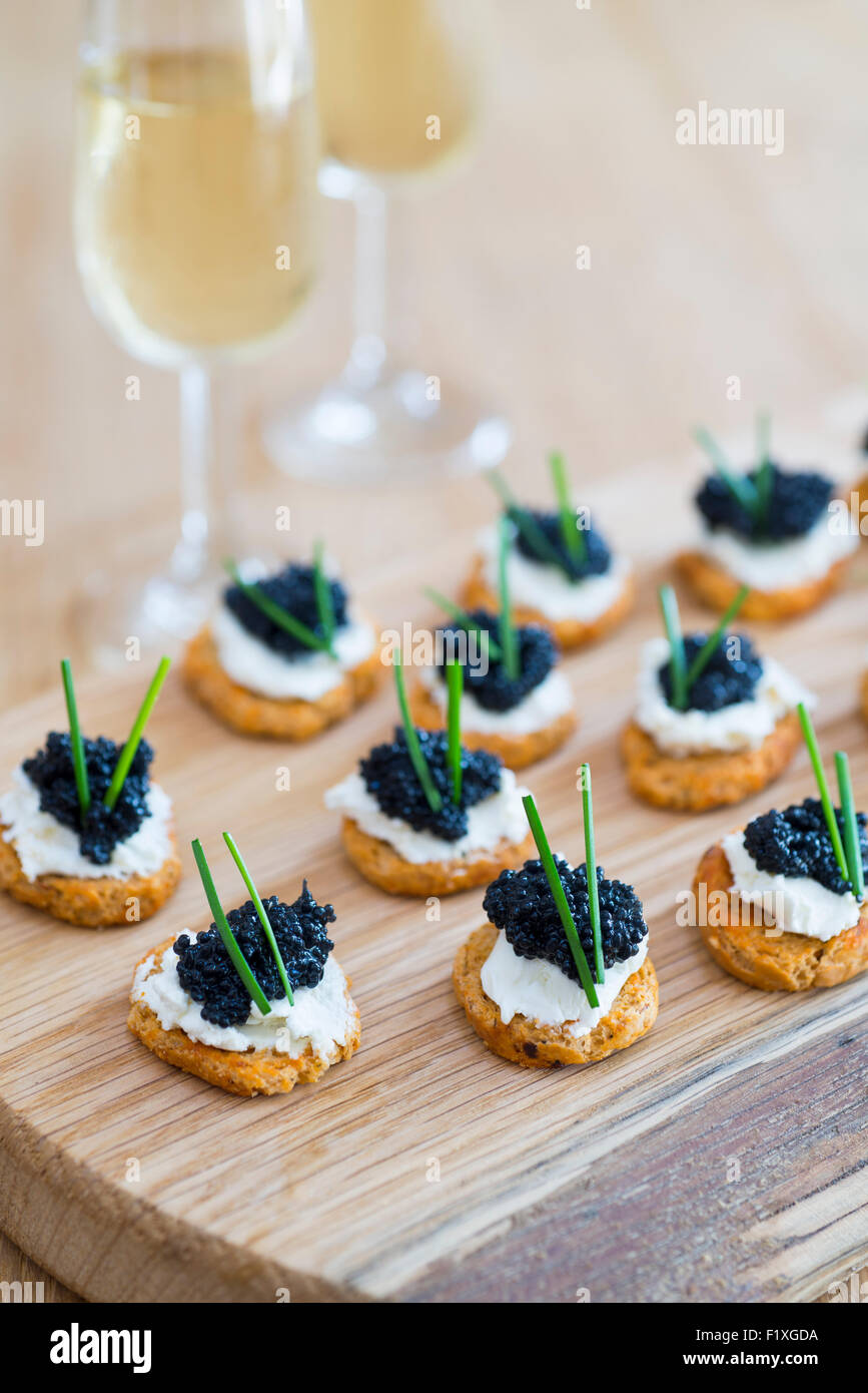 Canapes made from crostini with soft cheese and seaweed 'caviar' Stock ...