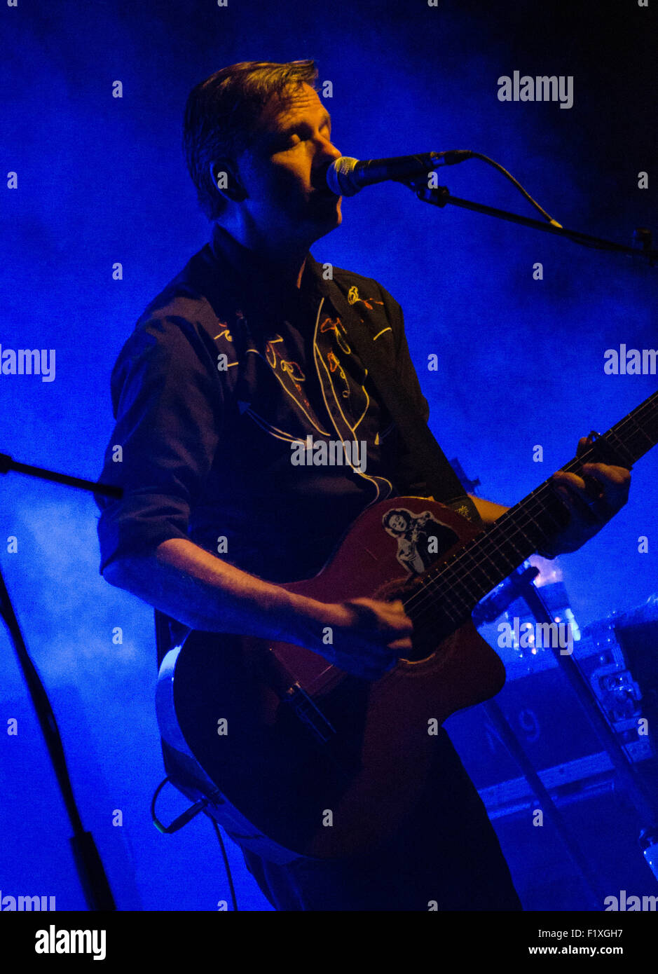 Joey Burns, frontman of the Tex-Mex band Calexico during a live show ...