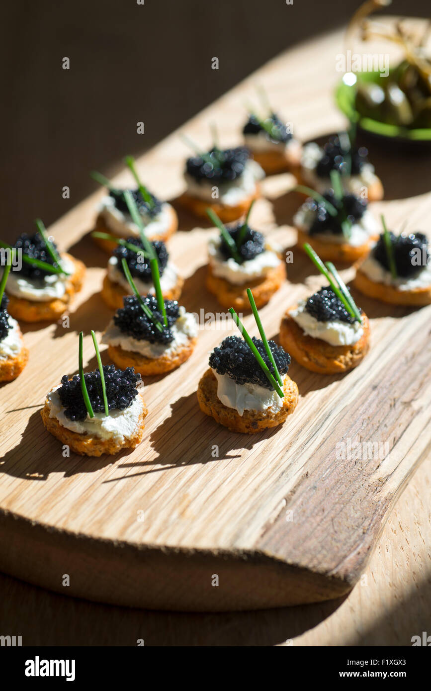 Canapes made from crostini with soft cheese and seaweed 'caviar' Stock ...