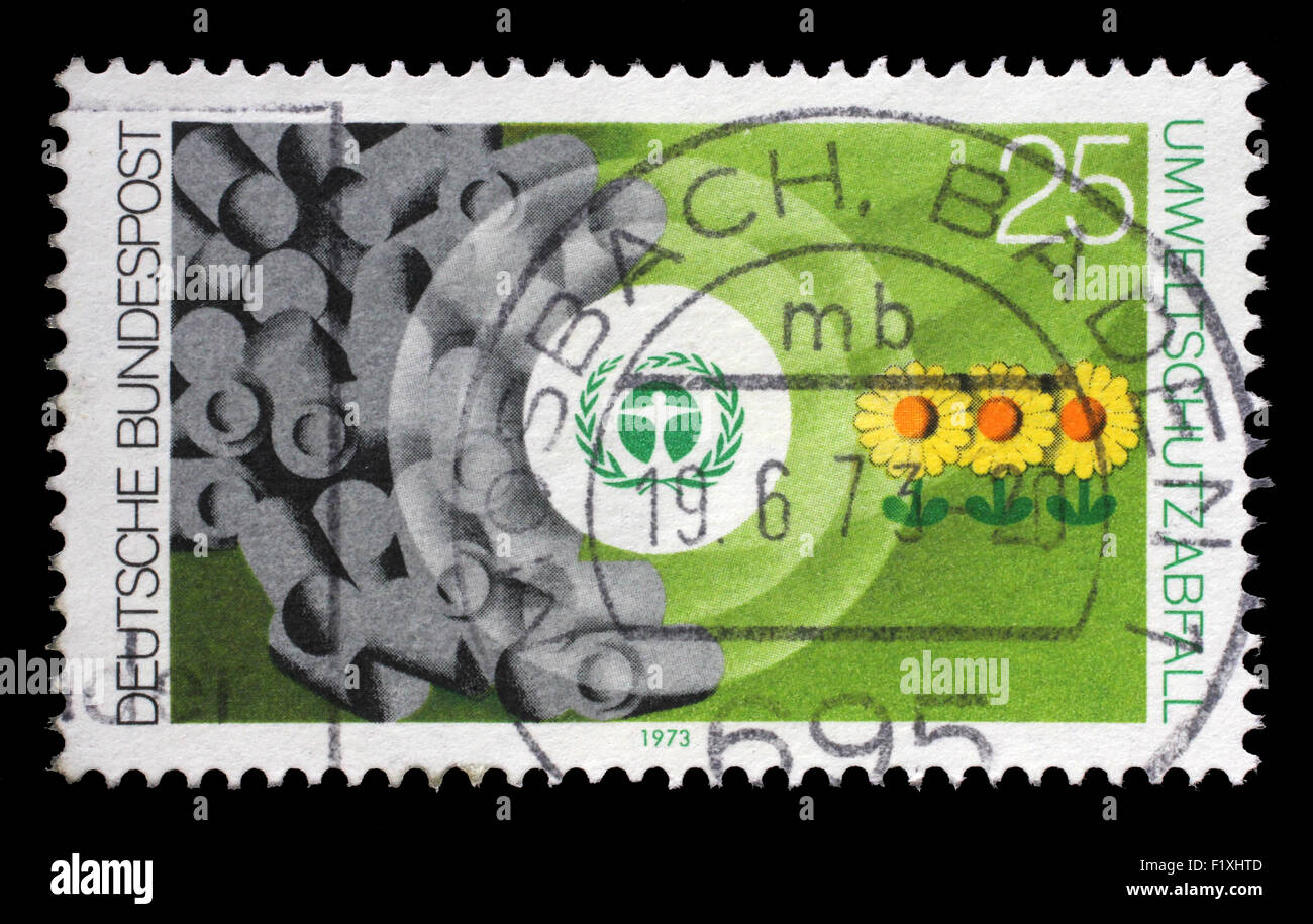 Stamp printed in the Germany shows Environment Emblem and Waste, Nature ...