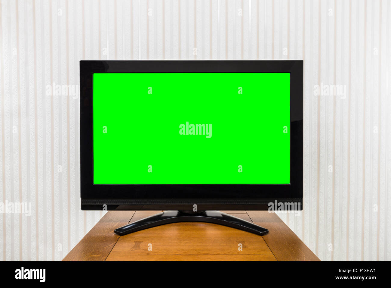 Modern television on wood table with green chroma key screen Stock ...