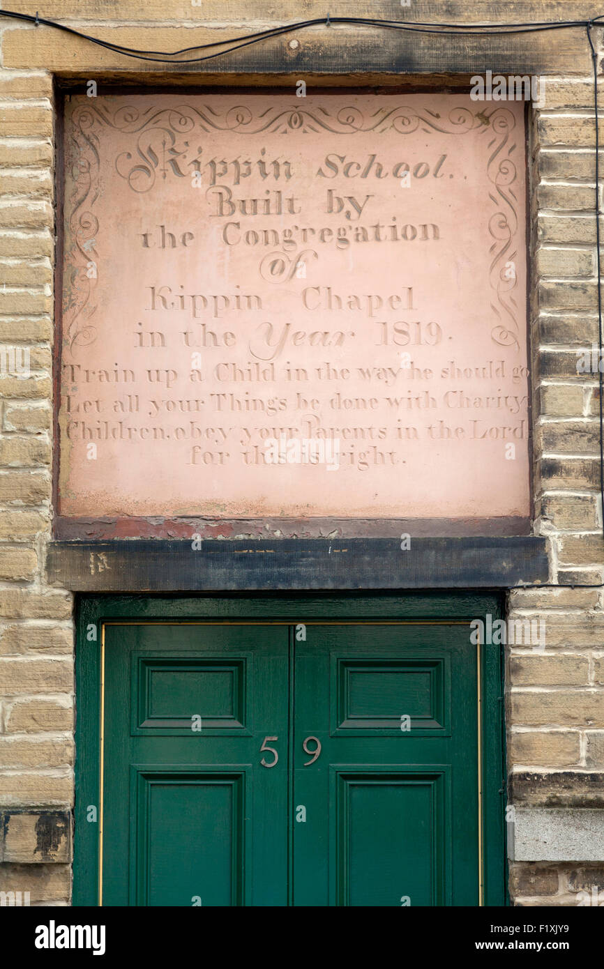 Old 19th century stone sign above door of former Kippin School ...