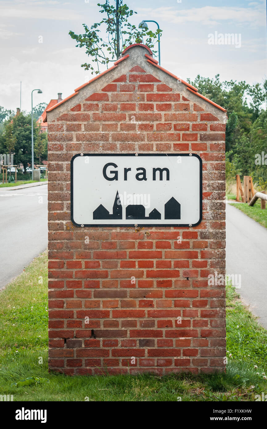 Gram city sign on a red brick post Stock Photo - Alamy