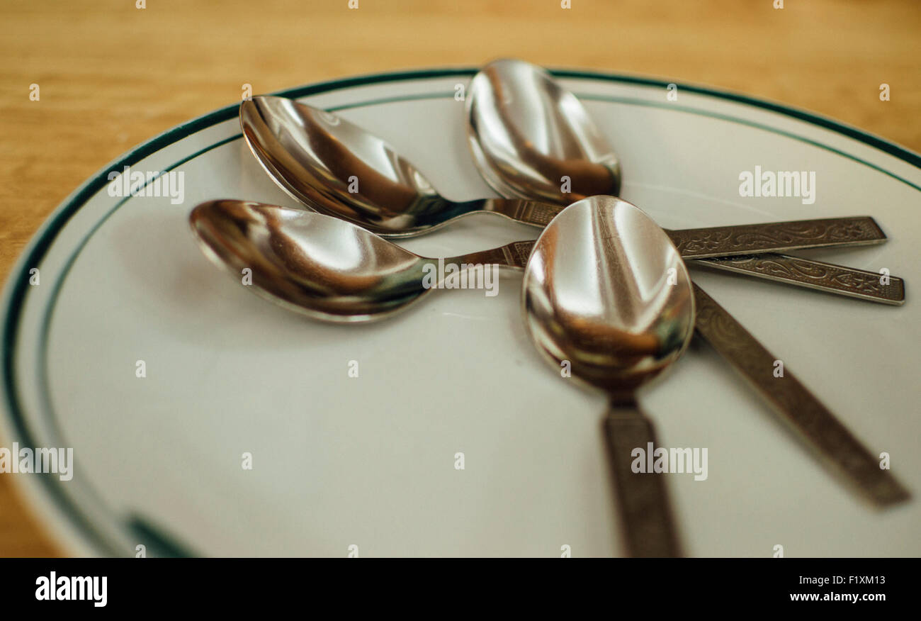 plate with 4 spoons Stock Photo - Alamy