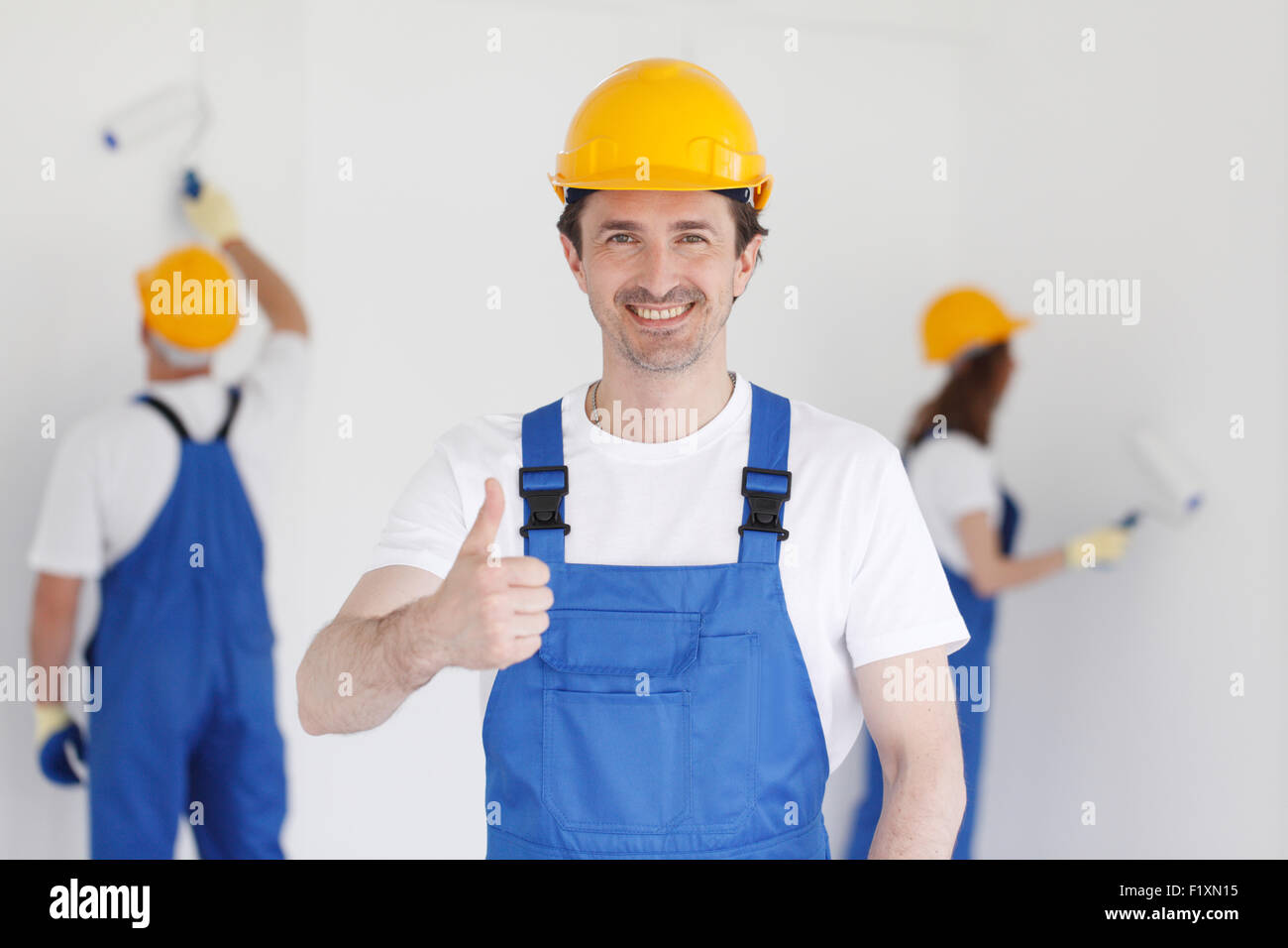 workman gives thumbs up Stock Photo - Alamy