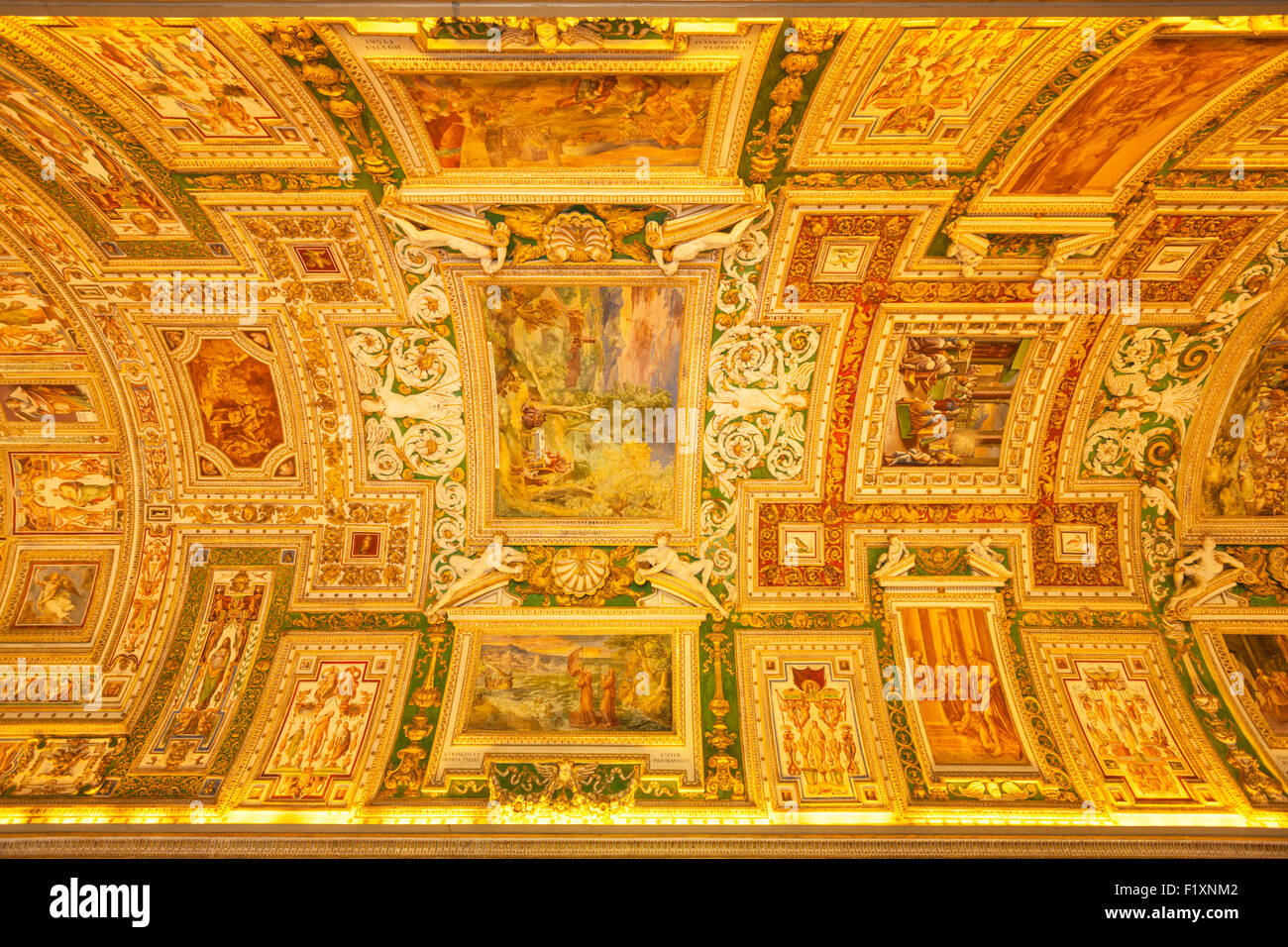 A highly decorated ceiling in The long Gallery of Maps Vatican Museums Vatican City Rome Italy ...
