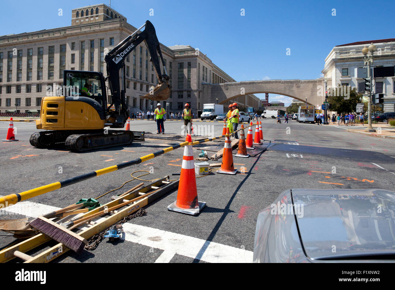 Municipal construction workers digging in city street - Washington, DC ...