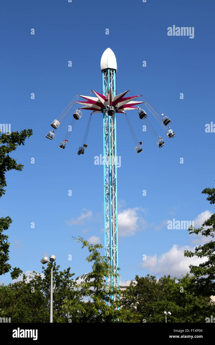 People enjoying the Starflyer fairground ride being used outside the ...