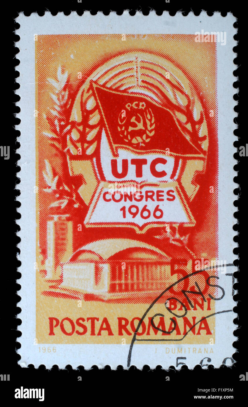 Stamp printed in Romania shows Congress badge and congress building ...