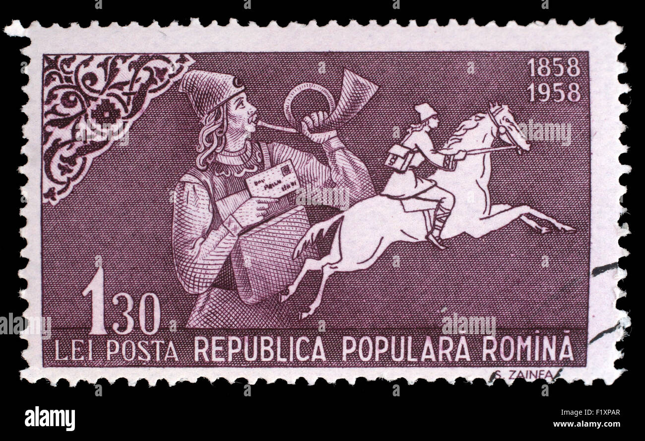 Stamp printed in Romania shows Post hornblowing postman and post rider ...