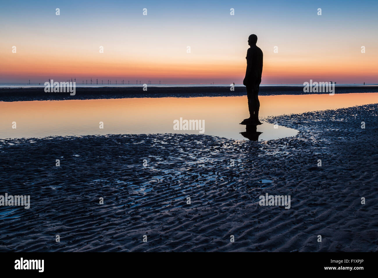 Silhouette of an Iron Man at sunset Stock Photo - Alamy
