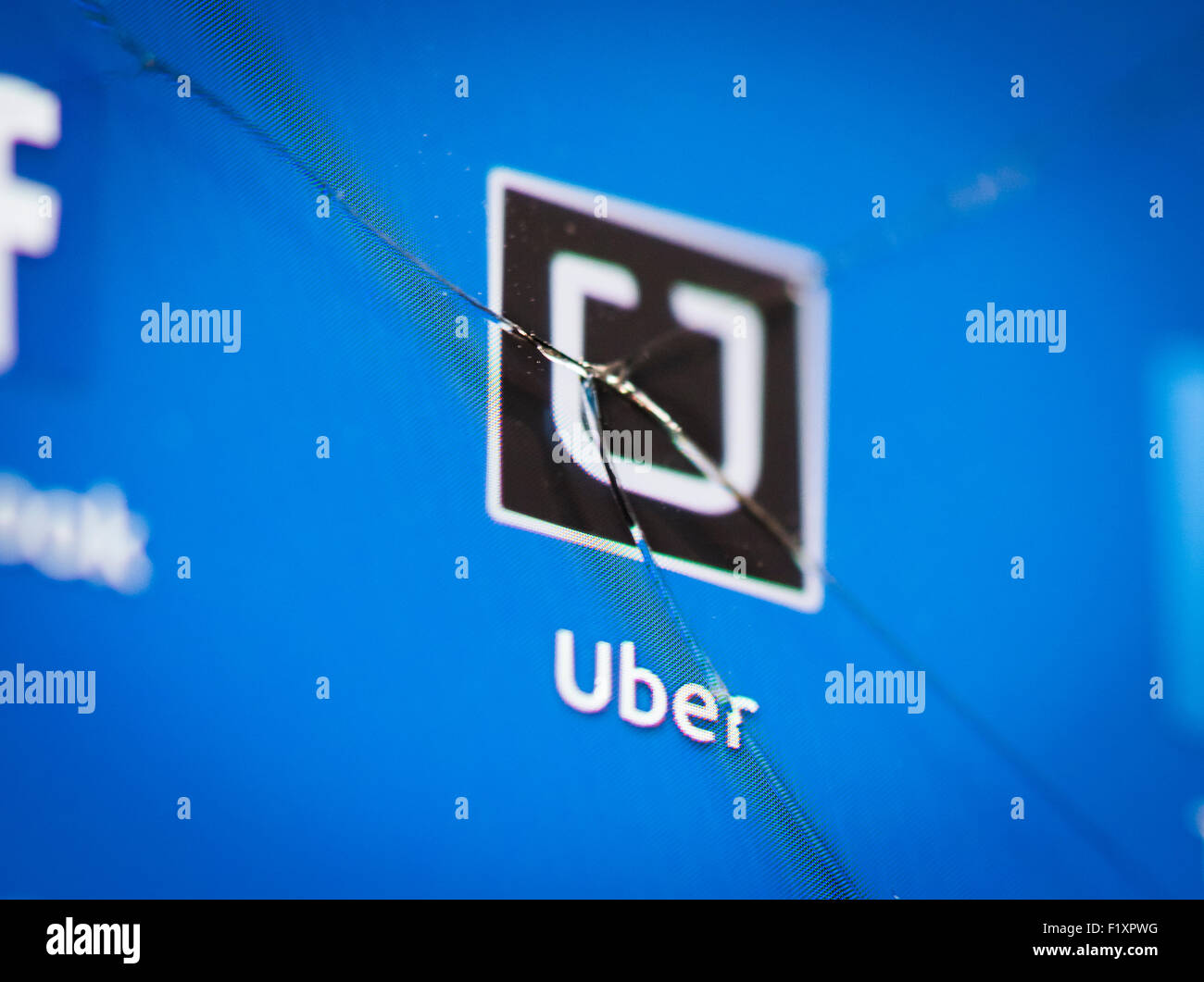 The icon of the Uber taxi service app is displayed on a smartphone ...