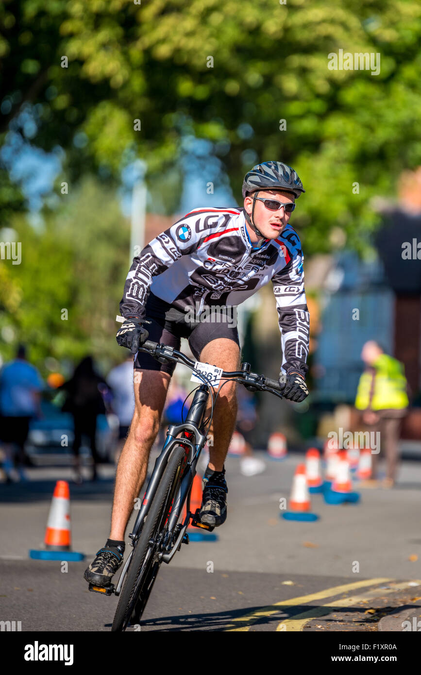 A man taking the corner during the 20k bike ride at The Carvers ...