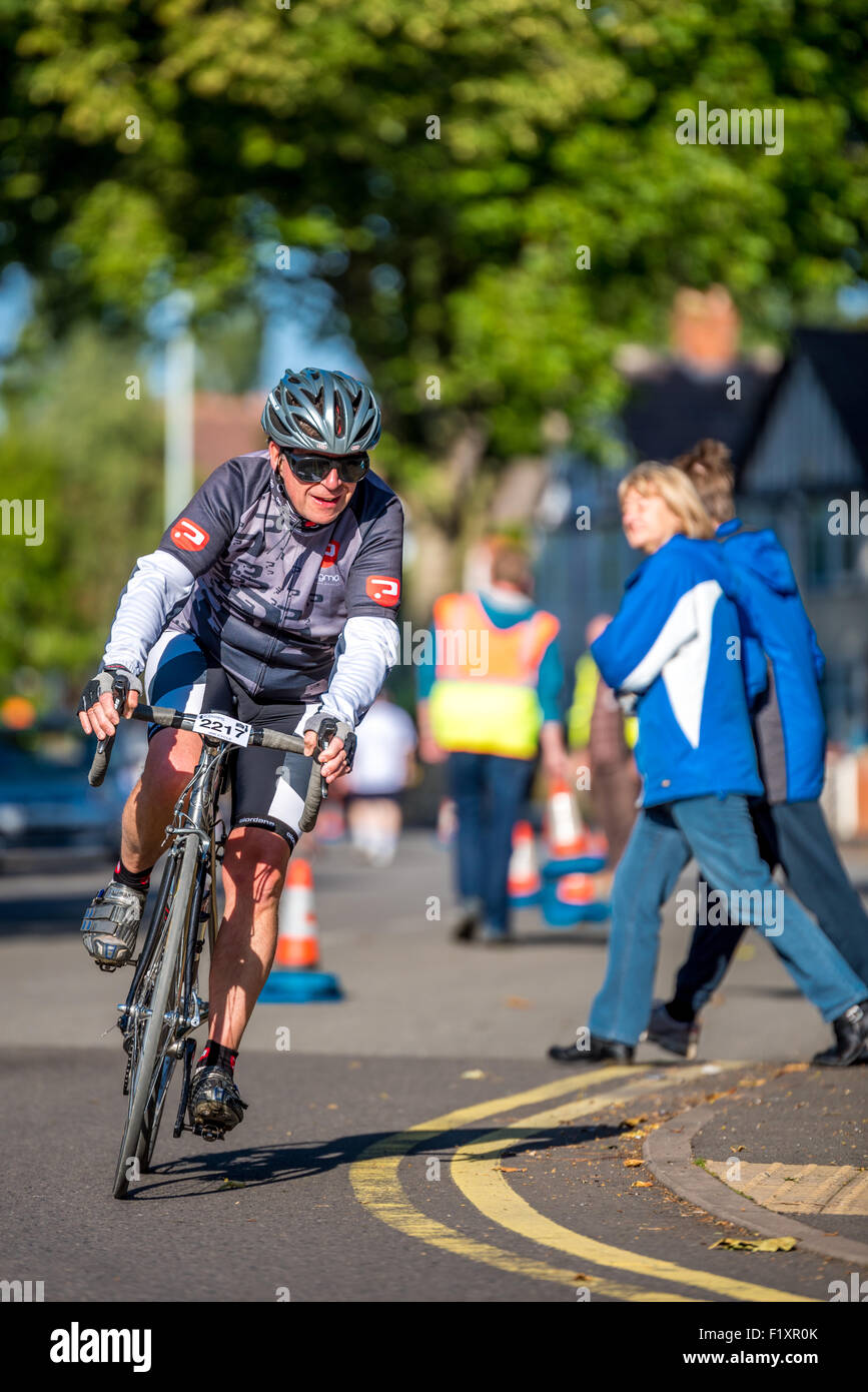 A man taking the corner during the 20k bike ride at The Carvers ...