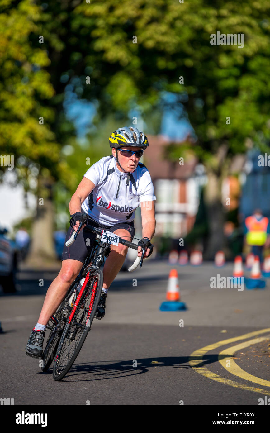 A cyclist cornering on her bike during the 20k bike ride at The Carvers ...