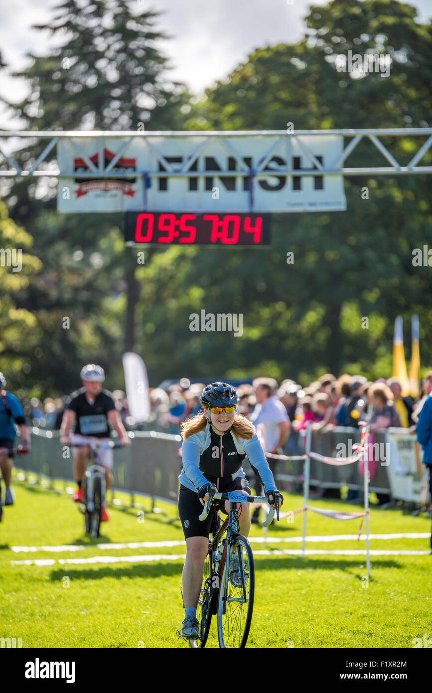 A young girl smiling as she finishes the 20k bike ride at The Carvers ...