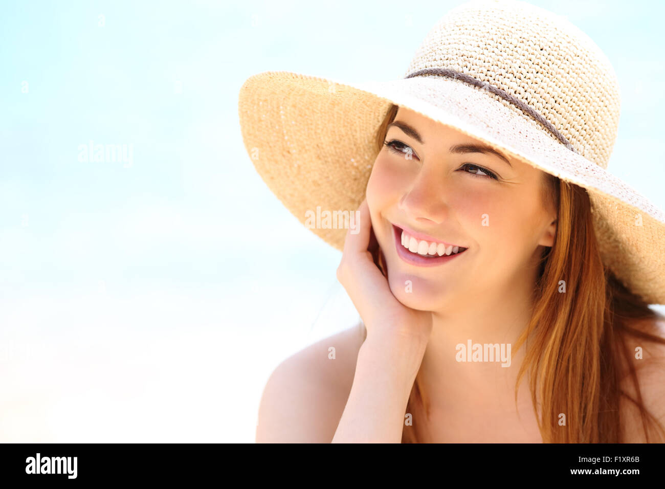 Beauty woman with white teeth smile looking sideways Stock Photo - Alamy