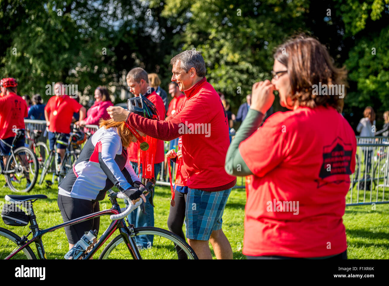 Riders receiving their medals for finishing the 20k bike ride at The ...