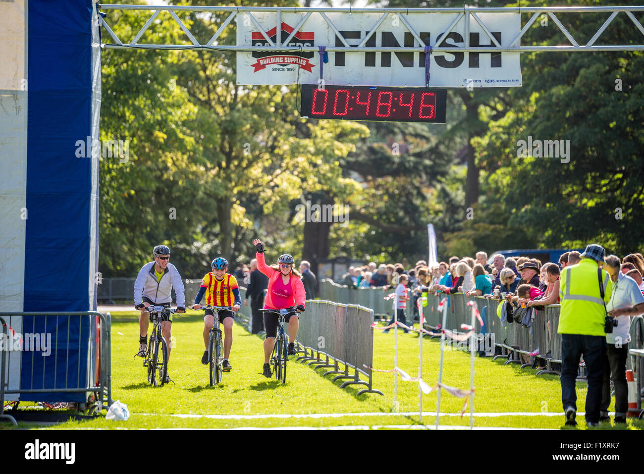 3 Cyclists finishing the 20k bike ride at The Carvers sponsored ...
