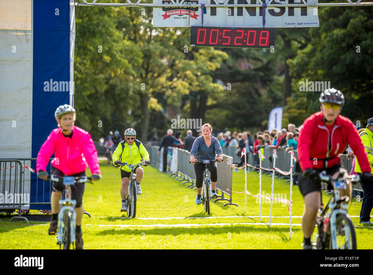Cyclists finishing the 20k bike ride at The Carvers sponsored ...