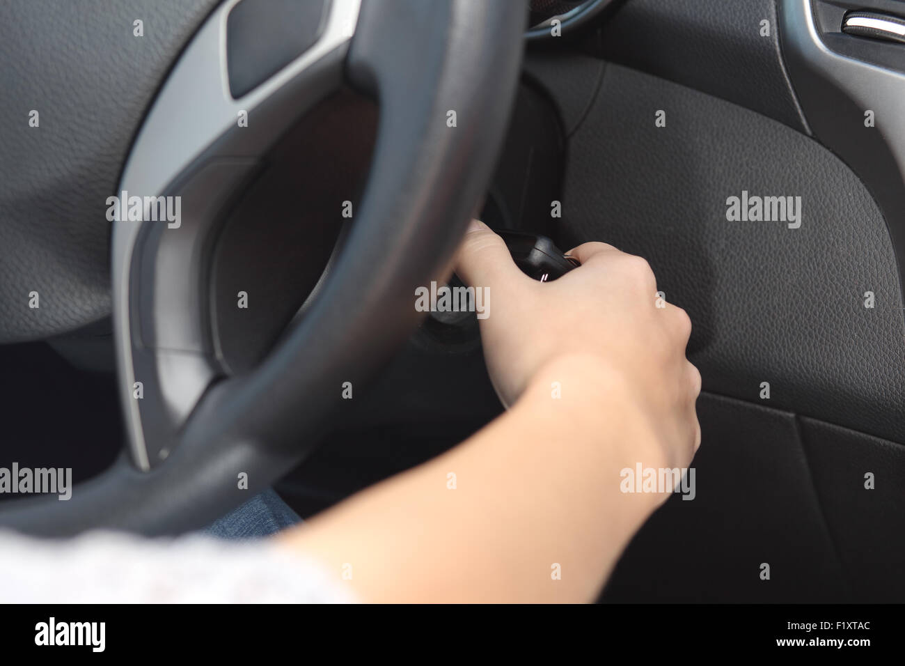 Closeup of a driver hand starting the car with the key Stock Photo - Alamy
