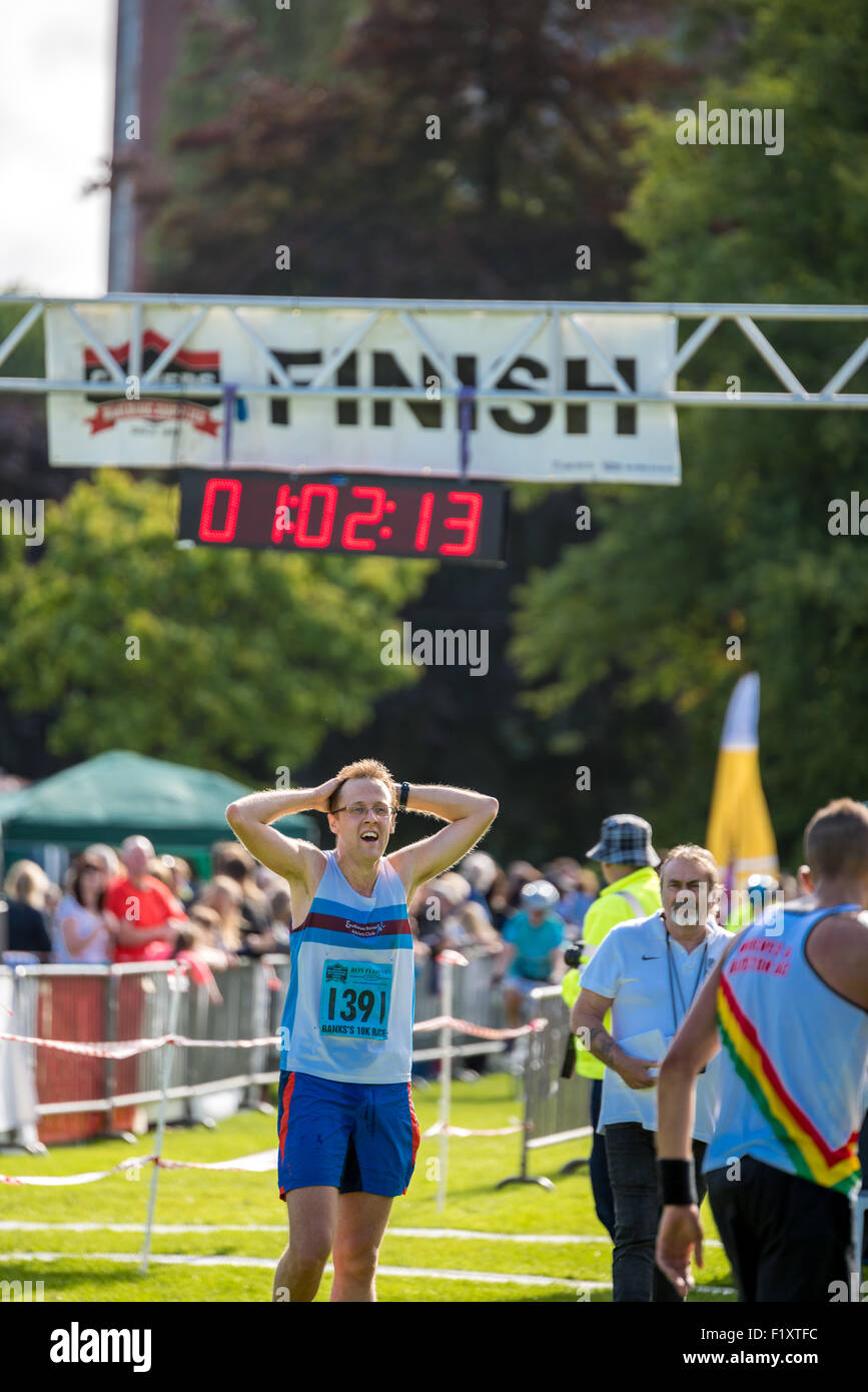 A man happy to have finished the 10k run at The Carvers sponsored ...