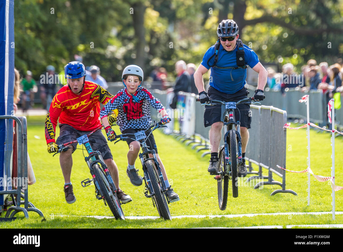 Three cyclists finishing the 20k bike ride at The Carvers sponsored ...