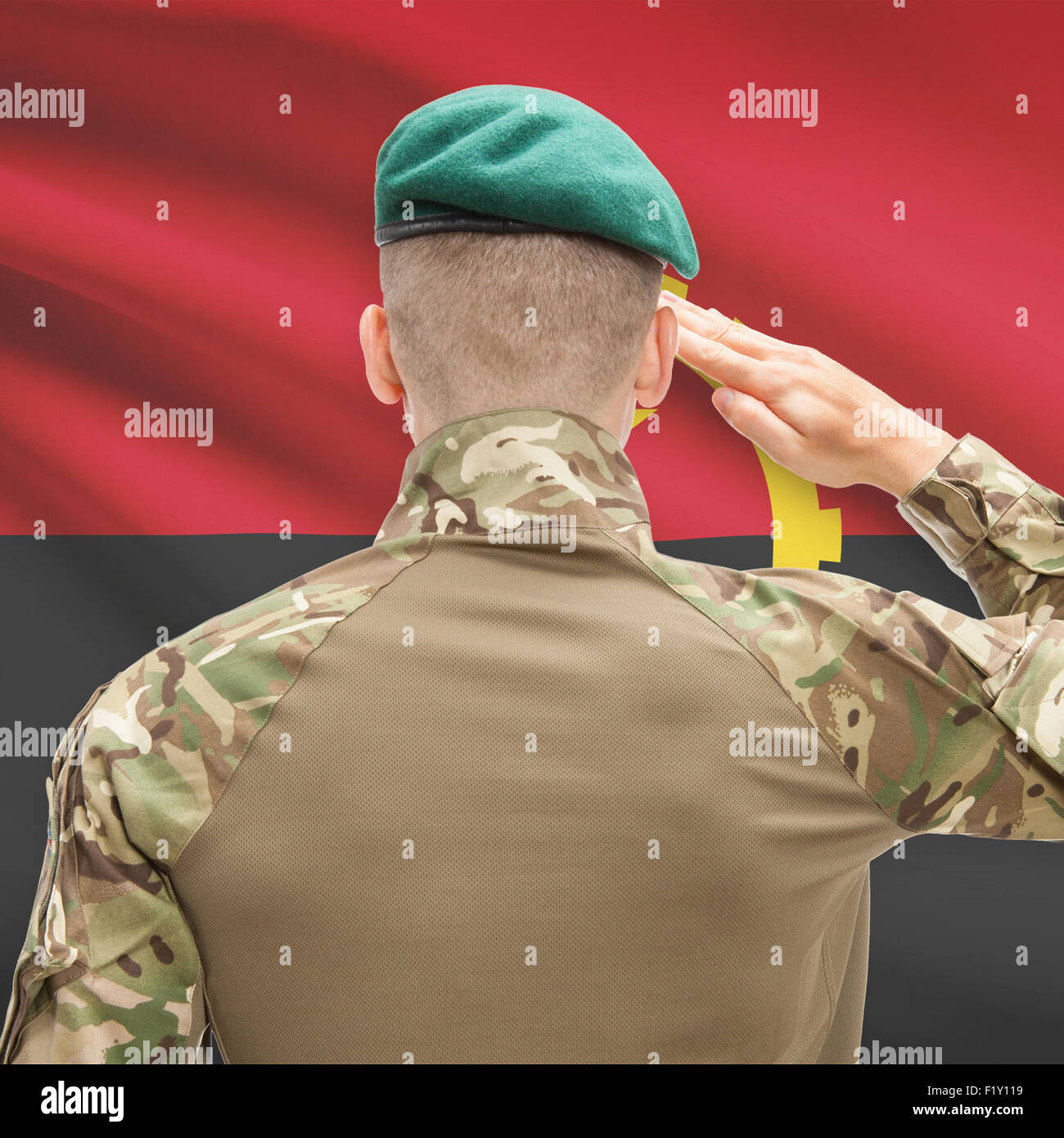 Soldier in hat facing national flag series - Angola Stock Photo - Alamy