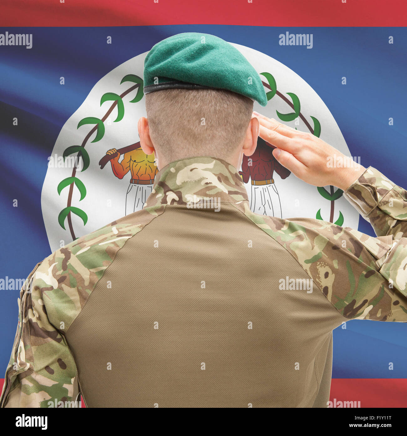 Soldier in hat facing national flag series - Belize Stock Photo - Alamy