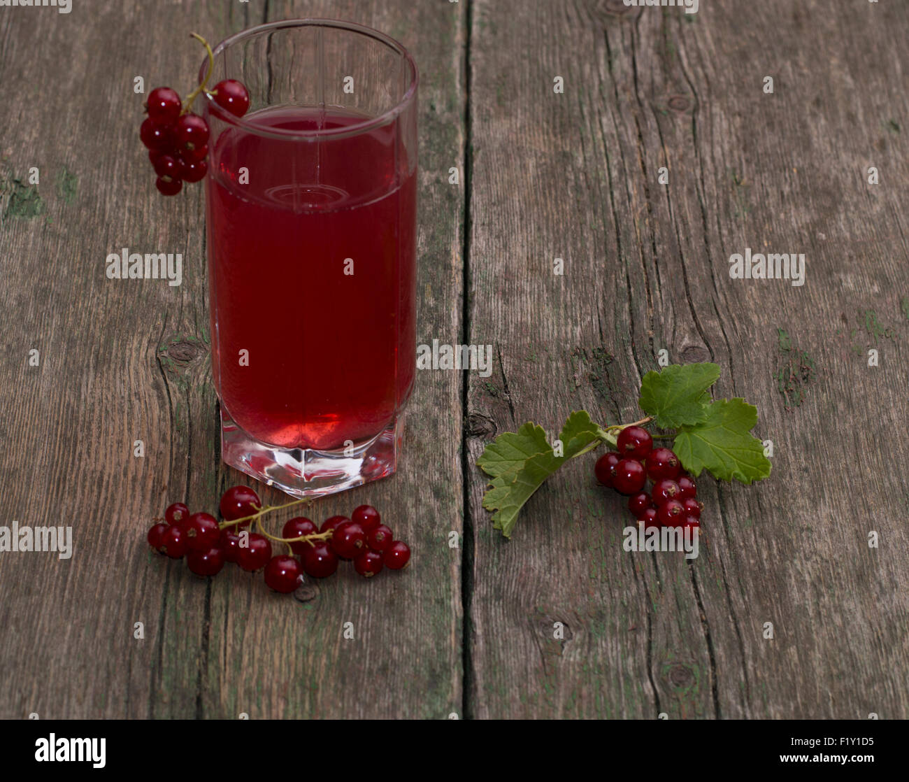 glass of red juice and currant for scenery Stock Photo - Alamy