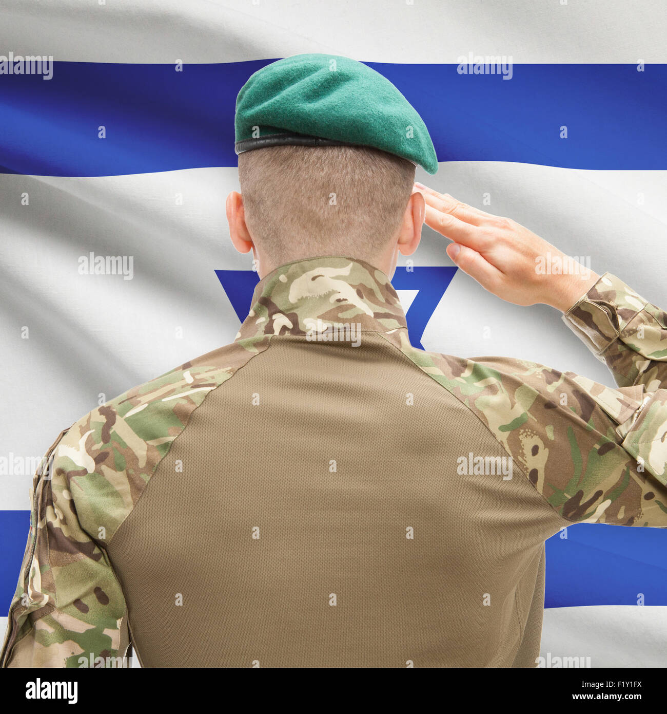 Soldier in hat facing national flag series - Israel Stock Photo - Alamy