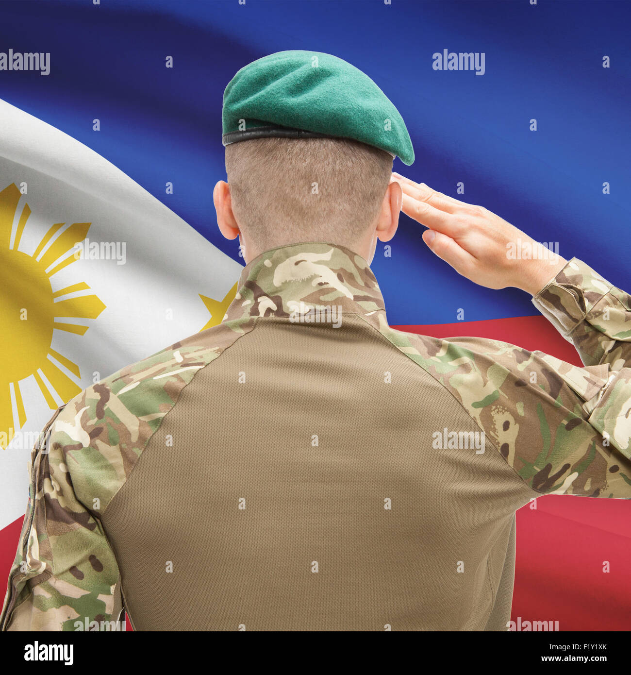 Soldier in hat facing national flag series - Philippines Stock Photo ...