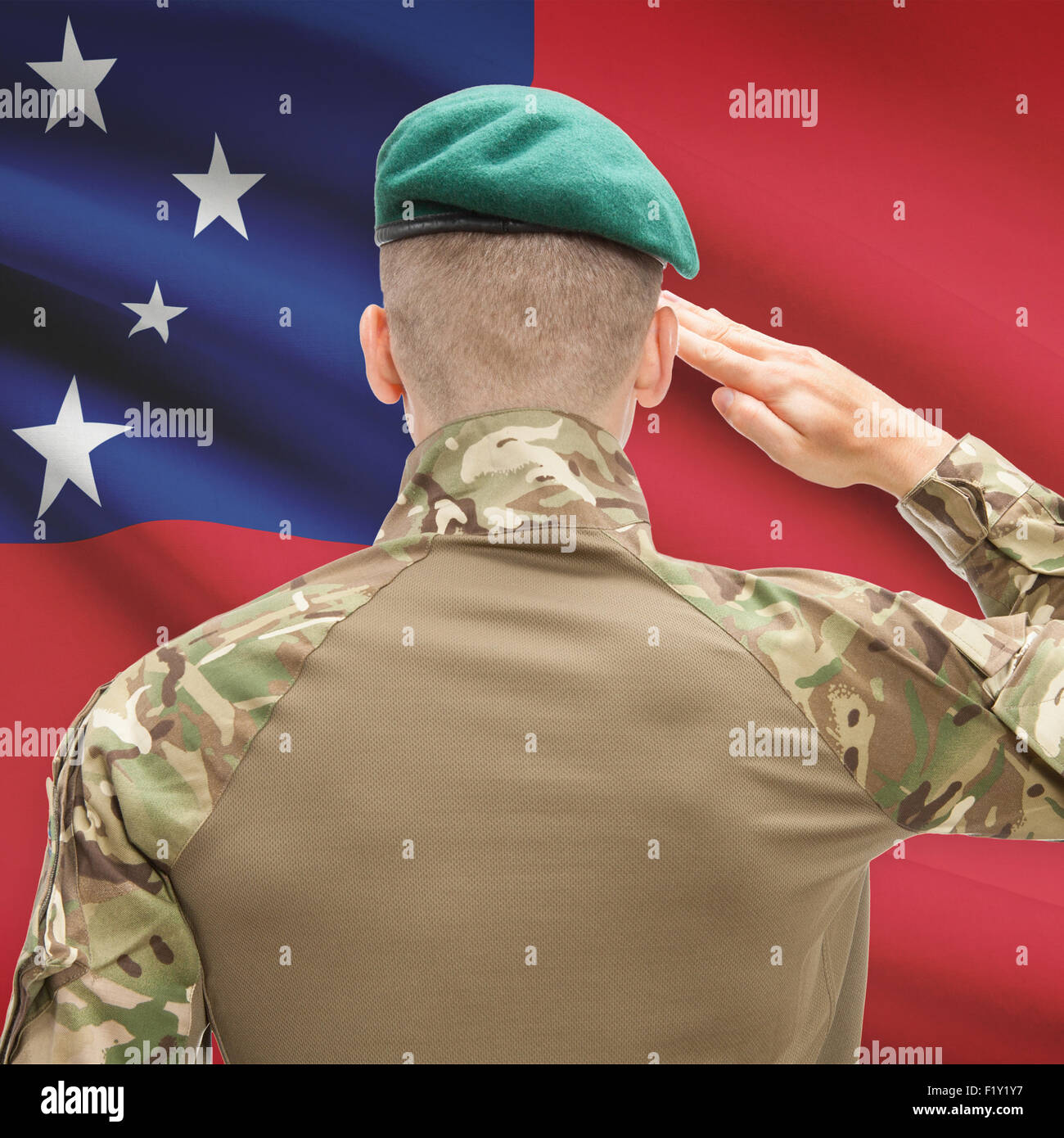 Soldier in hat facing national flag series - Samoa Stock Photo - Alamy