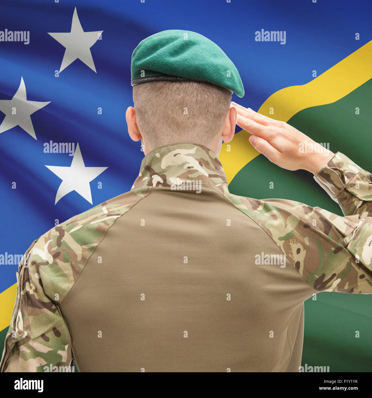 Soldier in hat facing national flag series - Solomon Islands Stock ...