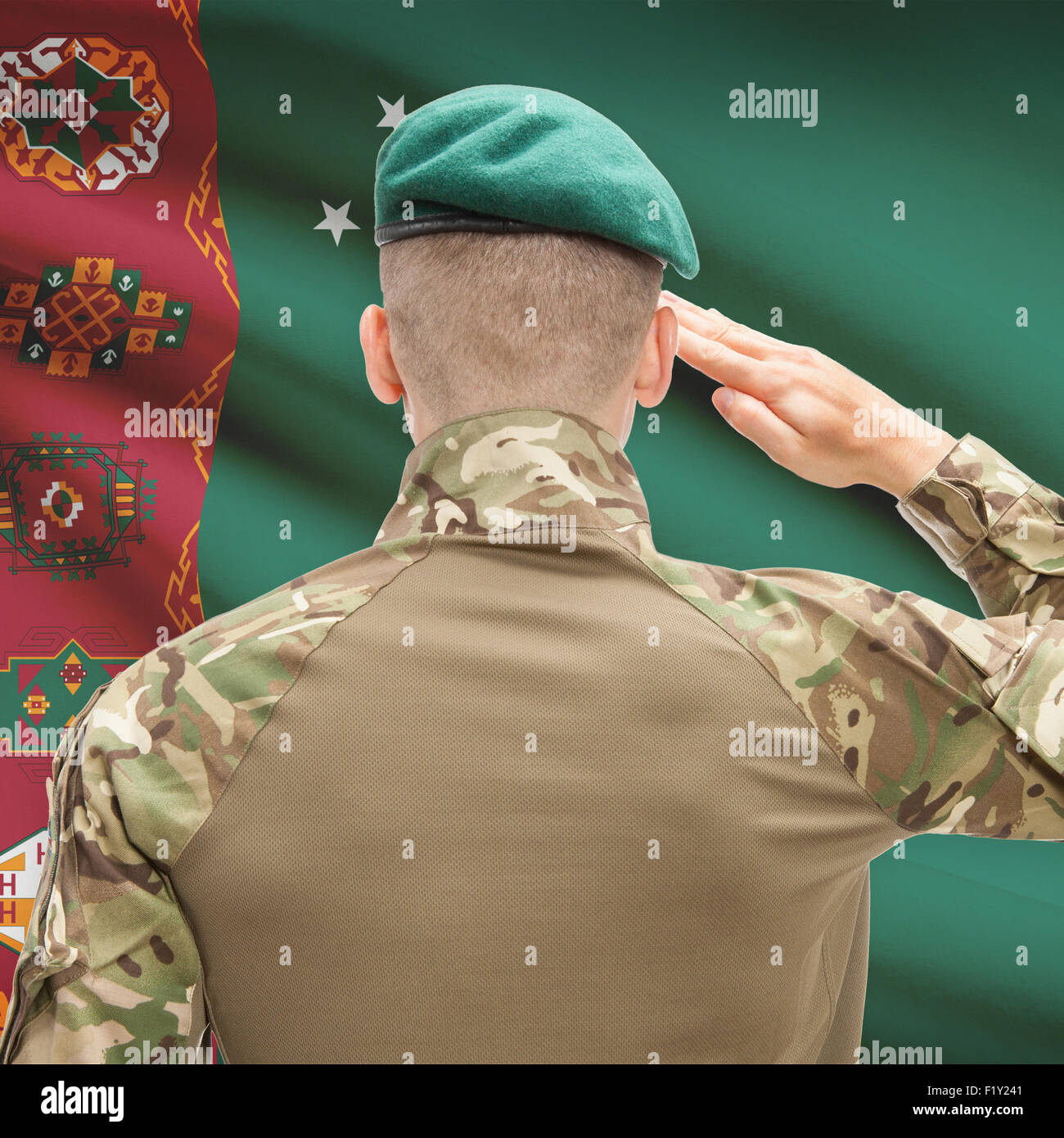 Soldier in hat facing national flag series - Turkmenistan Stock Photo ...