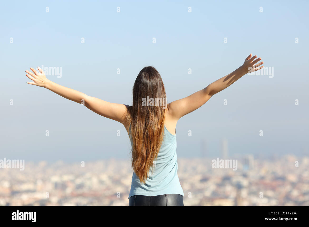 Woman raising arms High Resolution Stock Photography and Images - Alamy