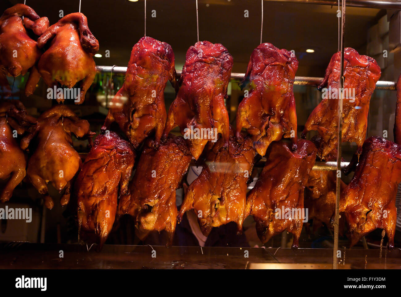 Duck drying in Chinese restaurant window Stock Photo - Alamy