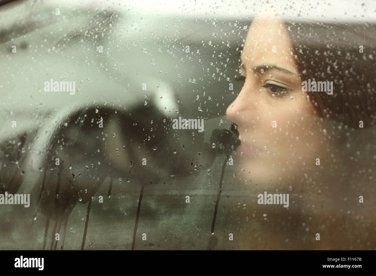 A Sad Girl Thinking In Rain