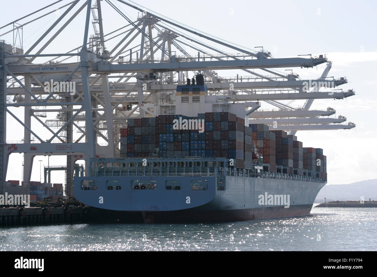 container ship being loaded at port facility Stock Photo - Alamy