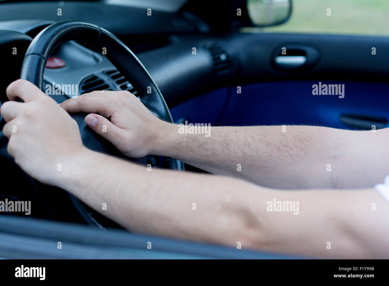 Male hands drive car holding hi-res stock photography and images - Alamy