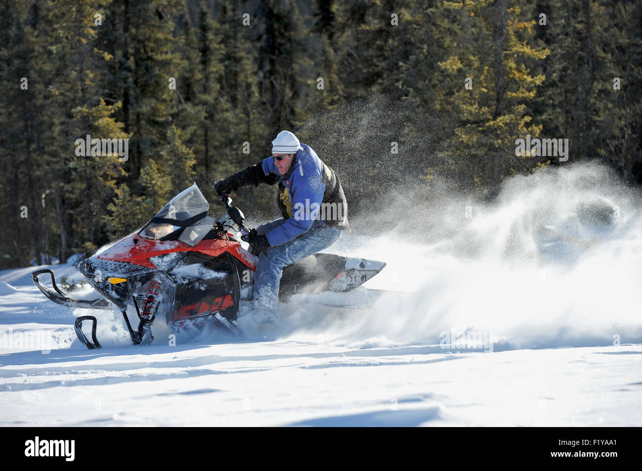 Man riding snowmobile hi-res stock photography and images - Alamy