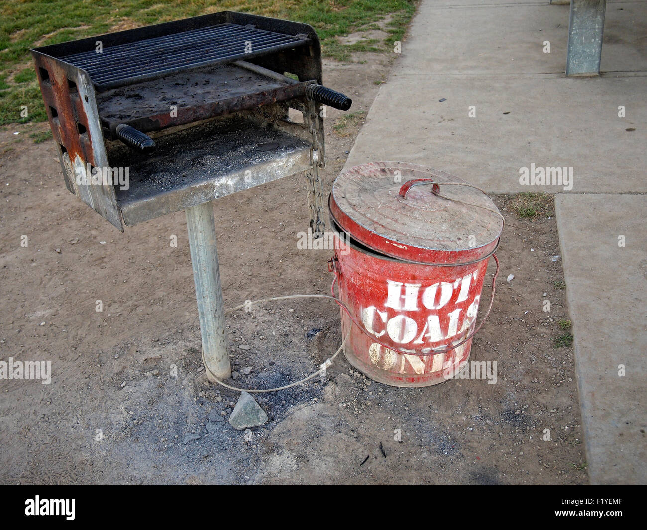 Barbecue station with Hot coals only can Stock Photo - Alamy