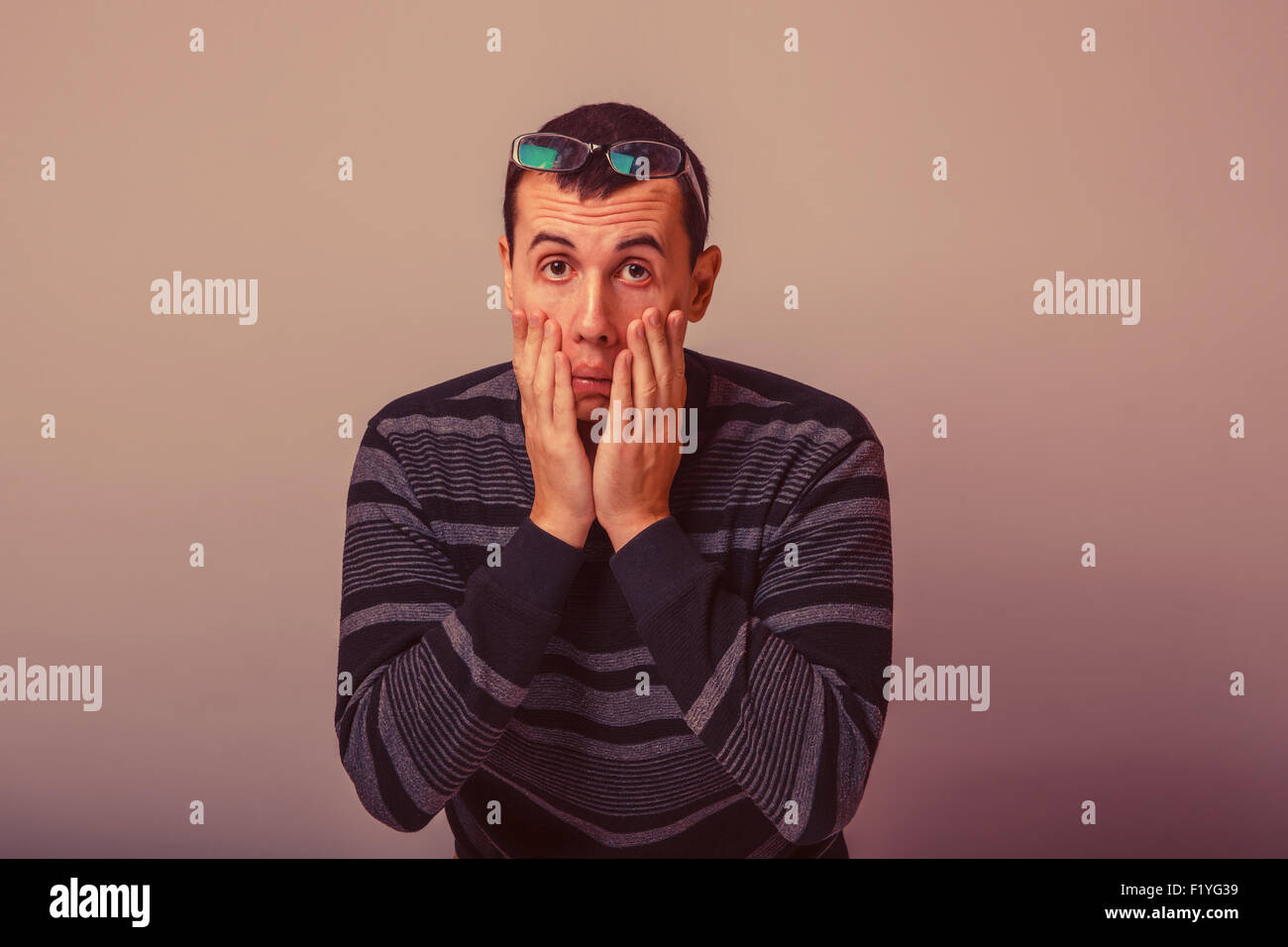 European-looking male of about thirty brunet stretches the eyes Stock ...