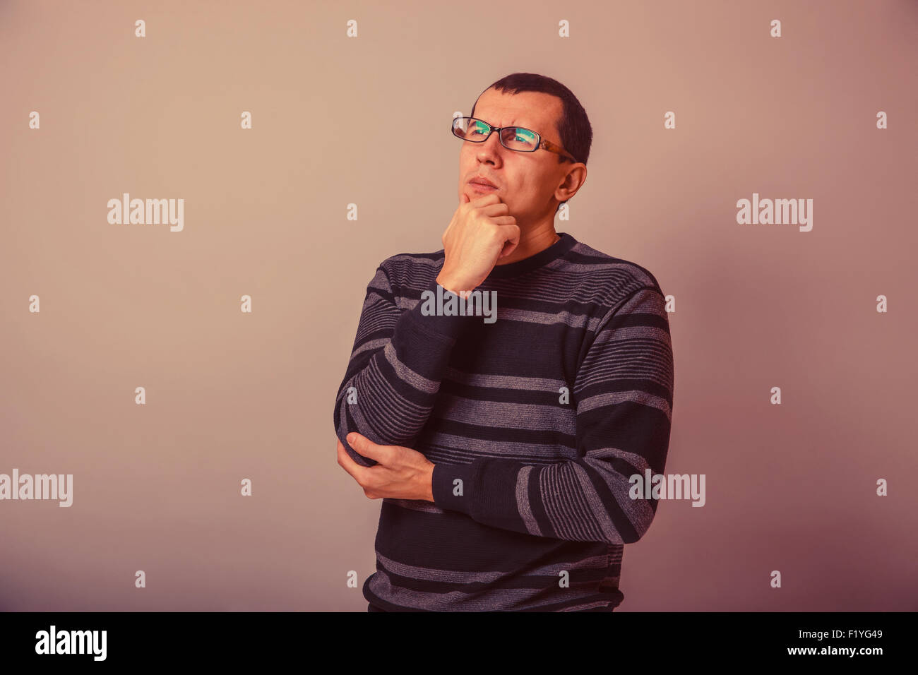 European-looking man of 30 years in glasses, thinking retro Stock Photo ...