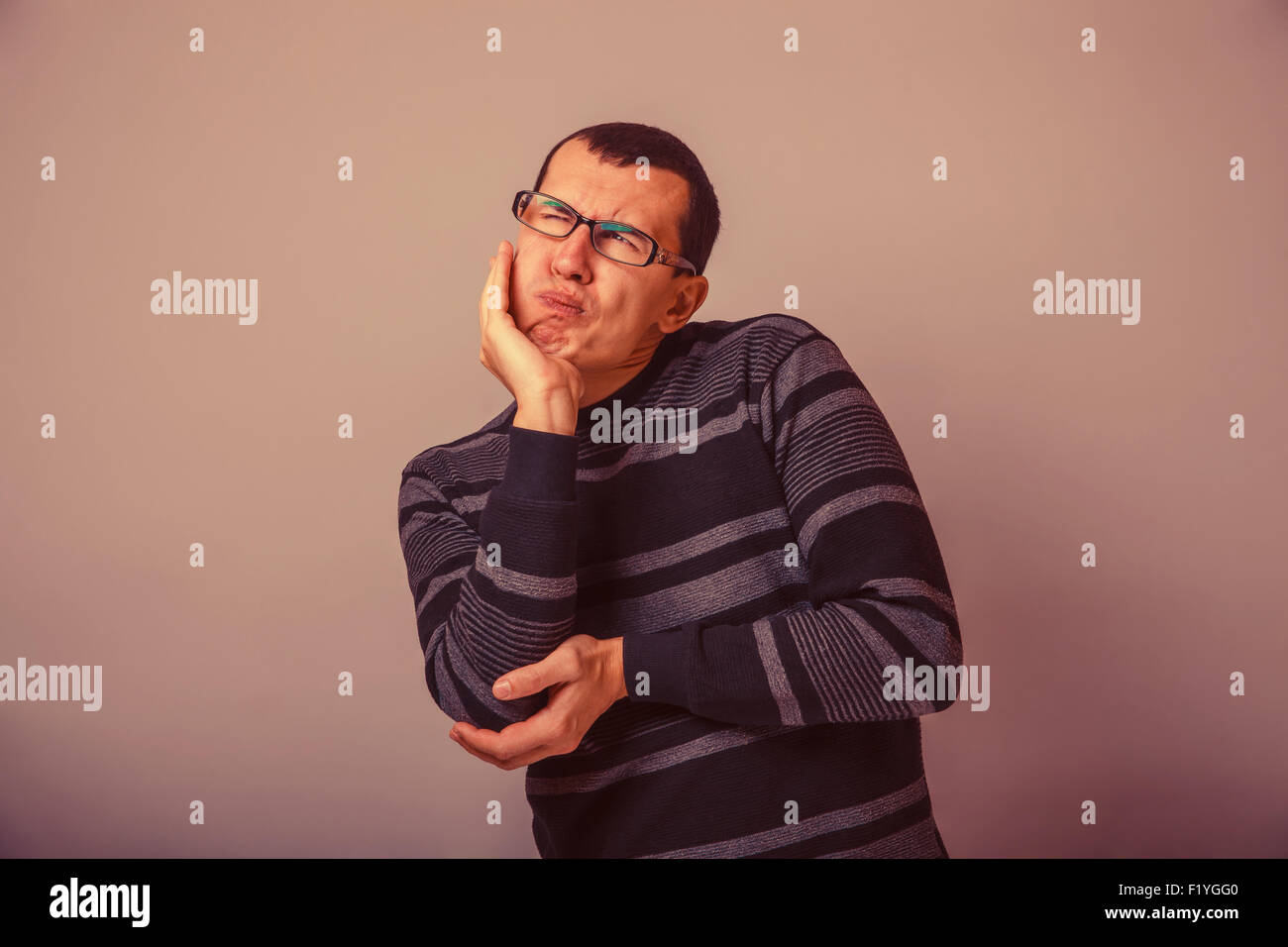 European-looking man of 30 years with glasses, toothache retro Stock ...