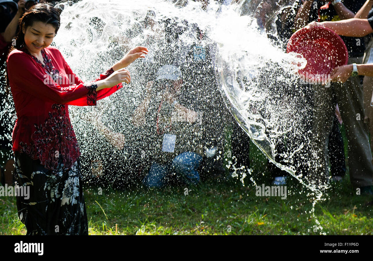 Young Asian models splashed with water Stock Photo - Alamy