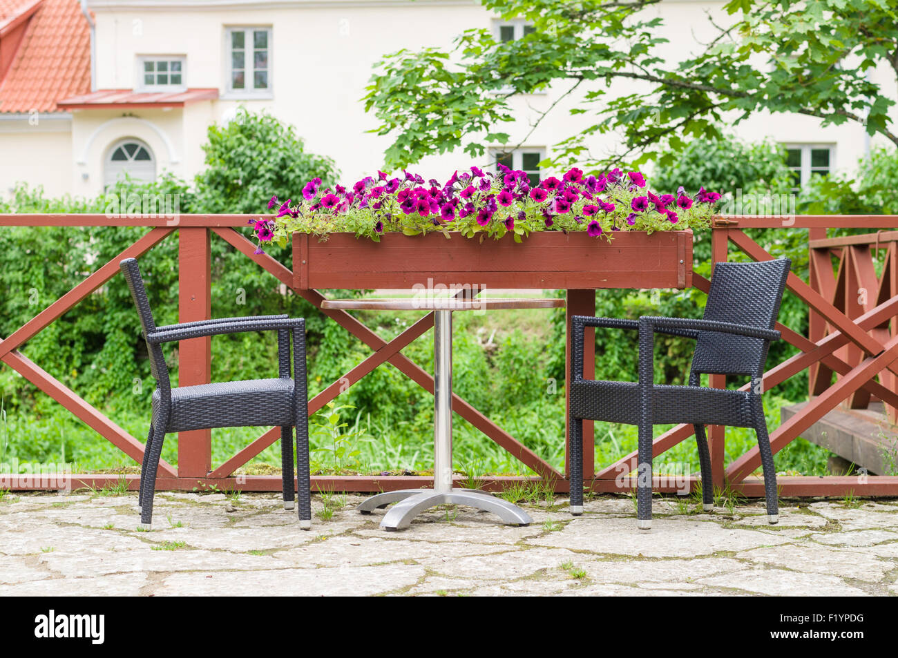 Outdoor terrace cafe with flower pots Stock Photo - Alamy