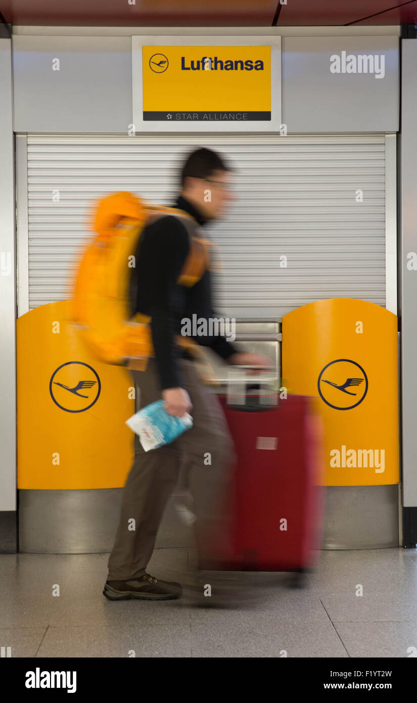 Berlin, Germany. 9th Sep, 2015. An air traveller passes by a closed ...